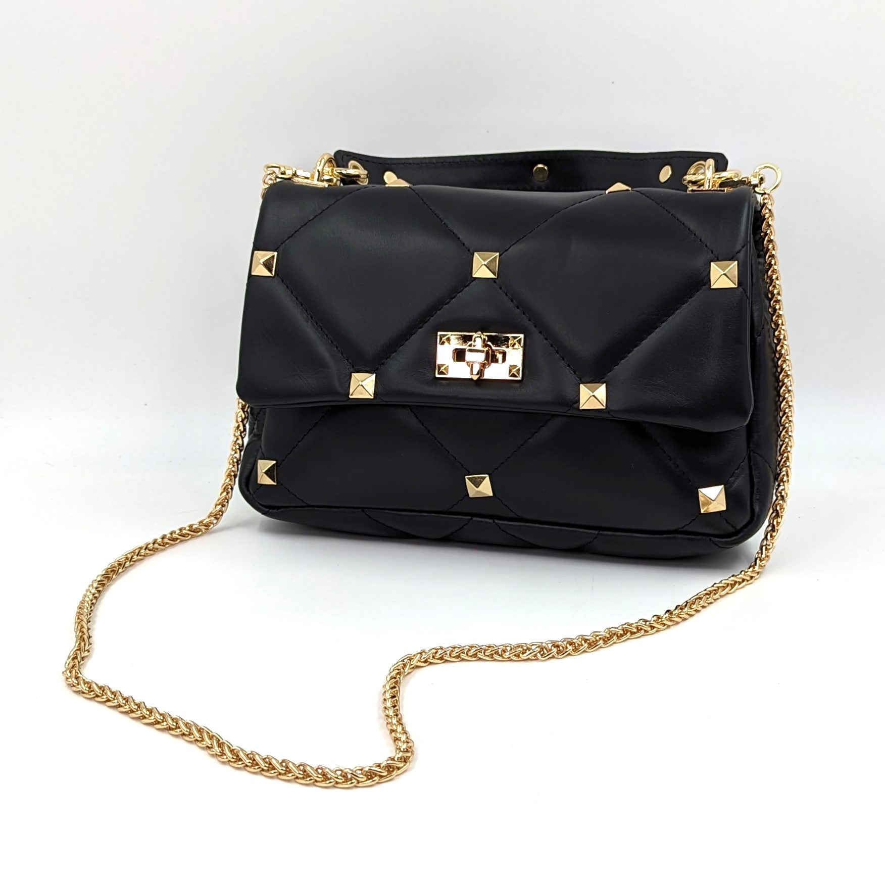 Super chic leather handbag with diamond shape stud hardware and twist ...